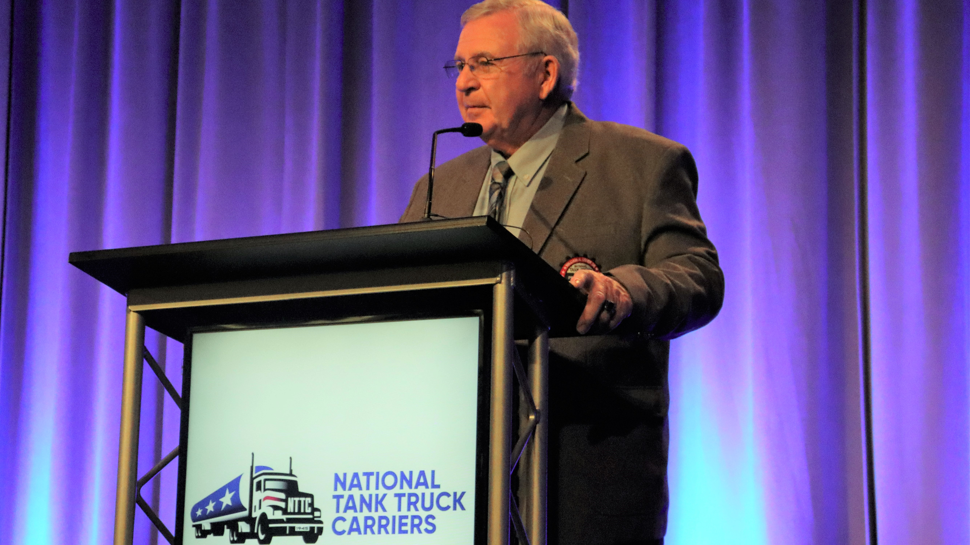 Highway Transport driver Thomas Frain secures William A. Usher, Sr ...